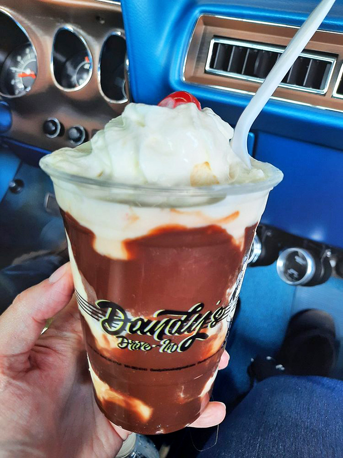 Banana Royal Sundae: where fruit meets ice cream in a glass vessel of pure happiness and strategic whipped cream.