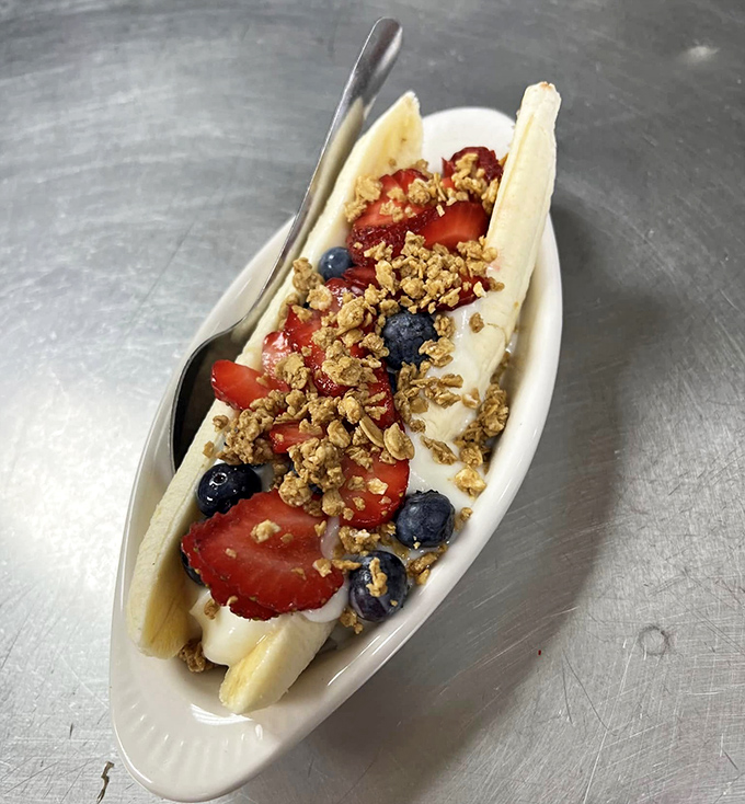 This banana split isn't dessert; it's edible nostalgia that transports you back to childhood while satisfying very grown-up taste buds.