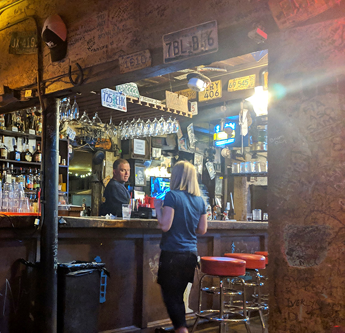 The bar isn't just serving drinks&mdash;it's serving history. Every license plate and wall scribble tells a story that gets better after your second bourbon.