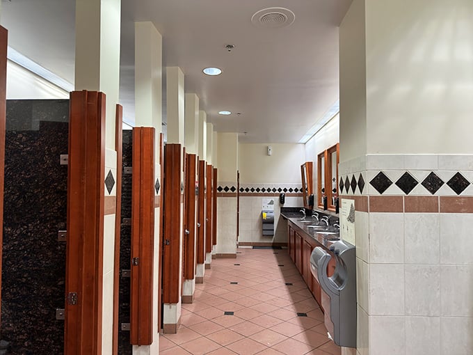Even outlet mall bathrooms deserve a touch of class. The diamond tile pattern subtly reminds you of the jewelry store you passed three shops ago.