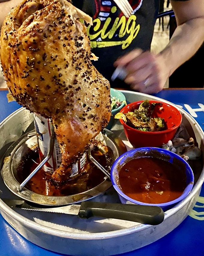 This isn't just chicken—it's a monument to the art of beer-can cooking. Served with sides that complement rather than compete with the star attraction.