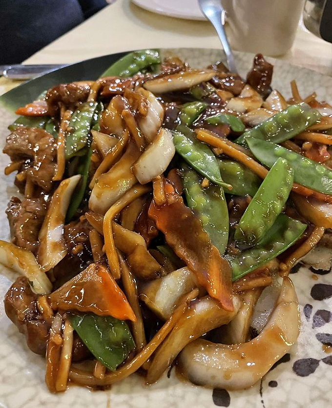 This isn't just beef chow fun&mdash;it's a masterclass in wok hei. Those charred edges and glistening sauce are telling you stories about proper heat control.