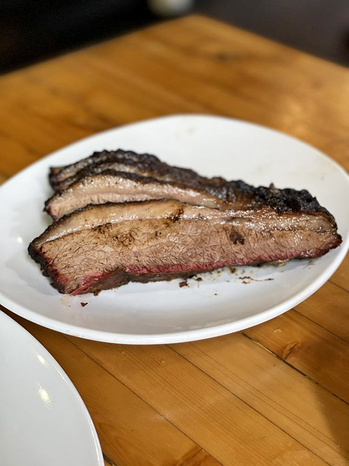 Brisket with that telltale pink smoke ring—nature's way of saying "patience rewarded" after hours of low-and-slow cooking.