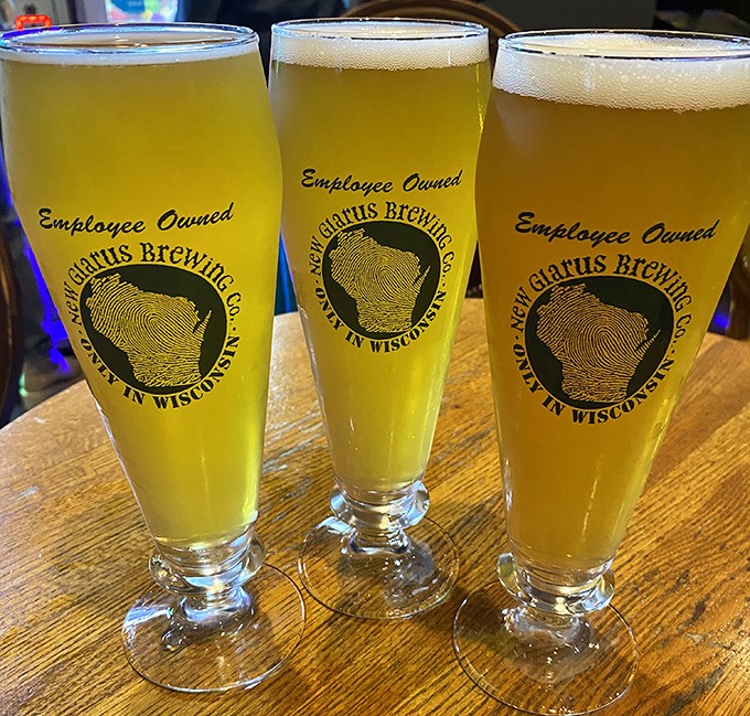 Three golden glasses of New Glarus beer&mdash;because in Wisconsin, "hydration" is just a fancy word for "another round, please."