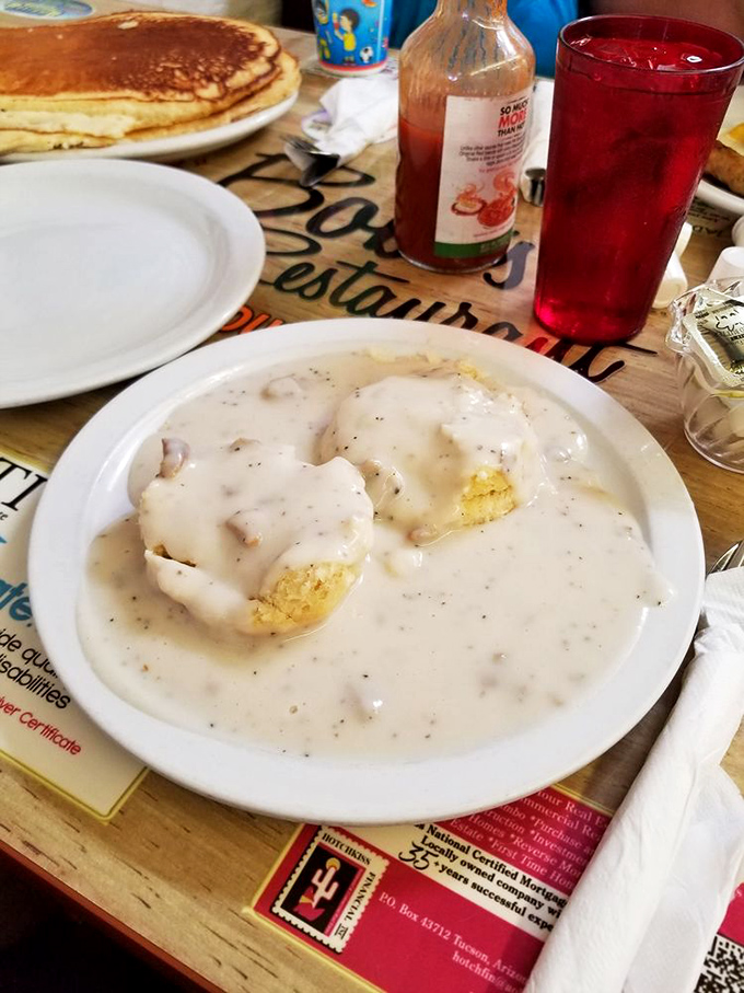 Biscuits swimming in a sea of peppery gravy &ndash; the breakfast equivalent of a warm hug from your favorite aunt who doesn't judge your life choices.