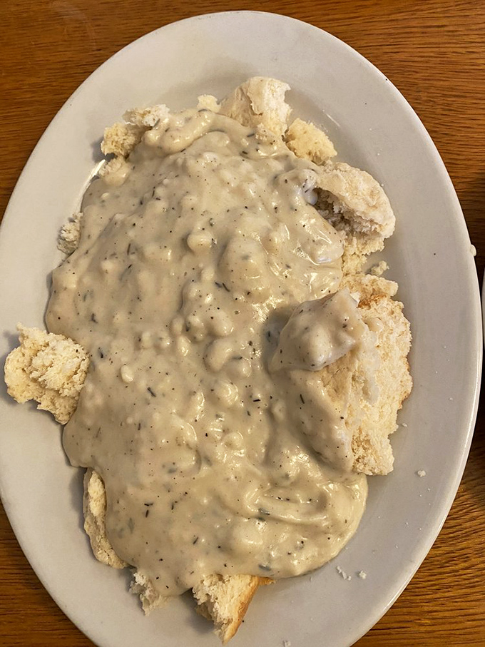 Biscuits and gravy that your Southern grandmother would respect. That pepper-speckled gravy blanket is comfort in its most delicious form.