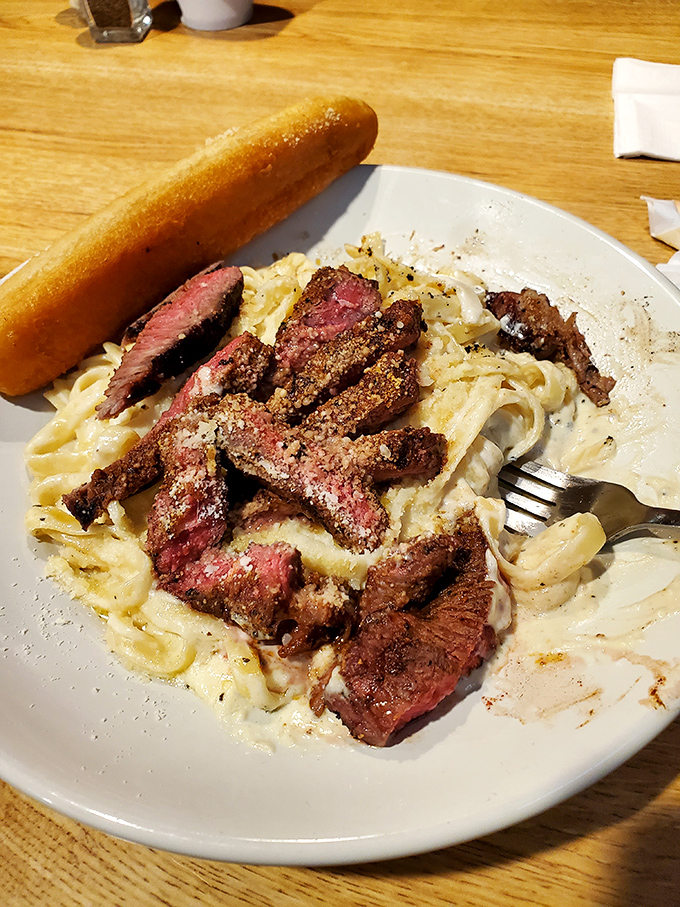 Blackened sirloin over creamy pasta &ndash; when you can't decide between Italian comfort and steakhouse luxury, why not have both? Genius.