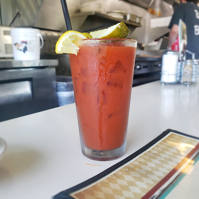 The Bloody Mary arrives like a spicy liquid salad, garnished with pickle and lemon. The perfect morning cocktail for when coffee just won't cut it.