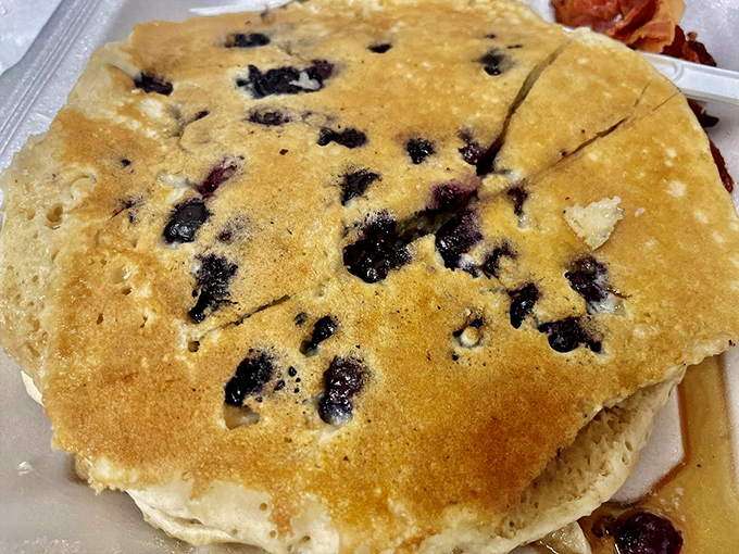 Blueberry pancakes that look like they're auditioning for a breakfast cereal commercial &ndash; golden, fluffy, and studded with berries that burst with every bite.