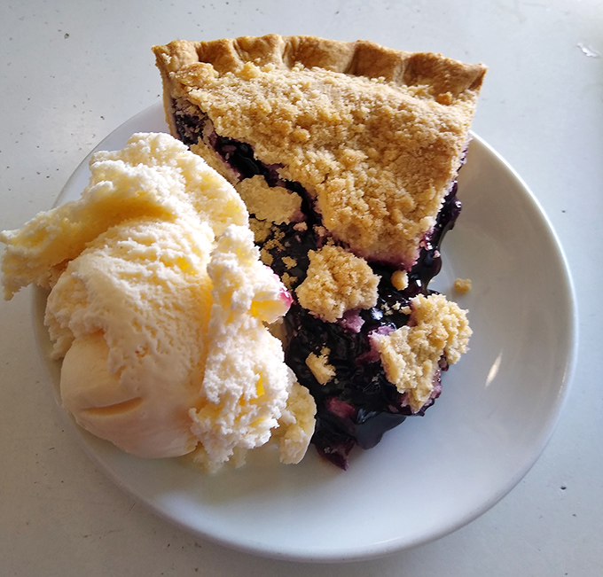 Blueberry pie with ice cream melting alongside&mdash;a dessert so perfect it deserves its own national holiday. Sweet dreams are made of this.