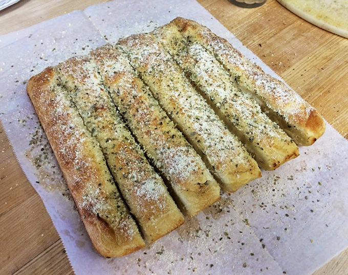 Breadsticks so buttery and garlicky, they're practically a food group unto themselves here.