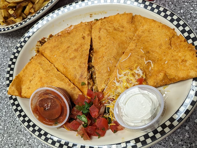 Breakfast quesadillas: where Tex meets Mex for morning magic. Those little cups of salsa and sour cream are about to make everything better.
