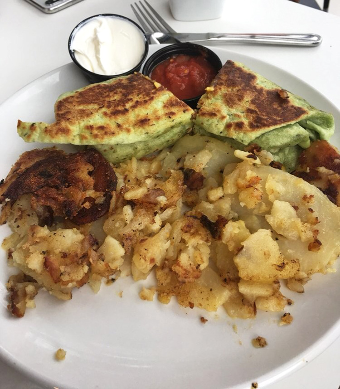 This isn't just breakfast, it's edible architecture&mdash;a perfectly grilled spinach quesadilla alongside home fries that deserve their own fan club.