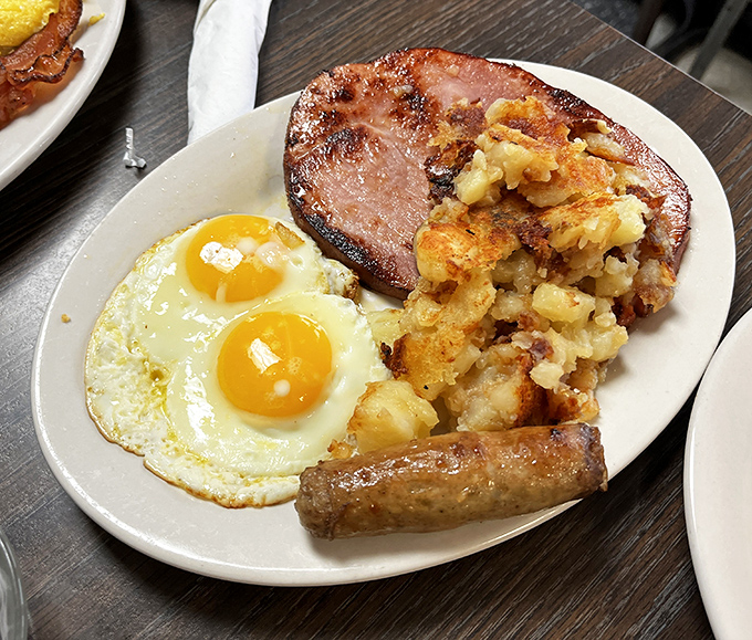 The breakfast trinity: sunny-side-up eggs, home fries, and ham steak. Religions have been founded on less compelling evidence of divine intervention.