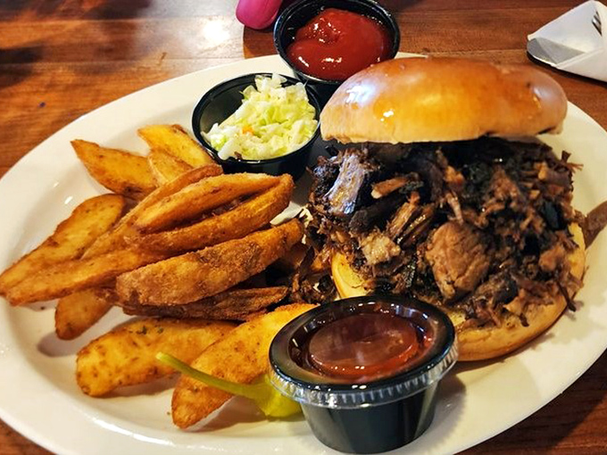 This pulled pork sandwich isn't messing around &ndash; it's bringing smoky, tender meat, crispy fries, and the kind of satisfaction money can't usually buy.