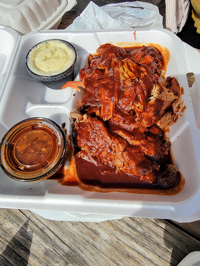 Pulled pork bathed in sauce that's been carefully calibrated between sweet, tangy, and "I need another napkin immediately."