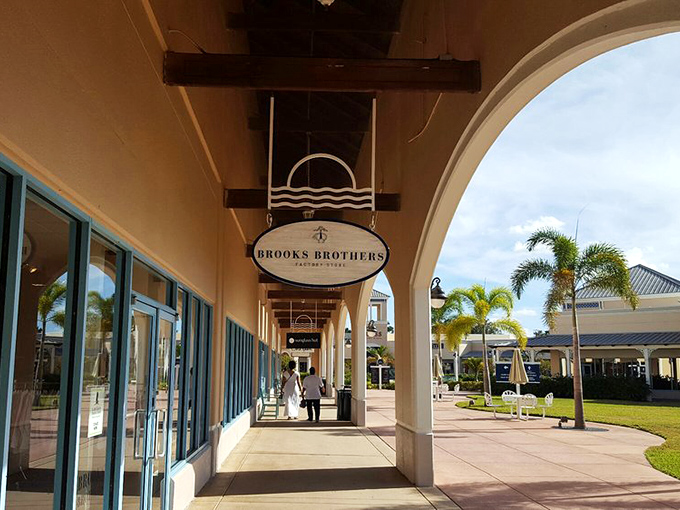 Brooks Brothers' covered walkway offers shade and sophistication, a brief respite before plunging back into the bargain-hunting fray.
