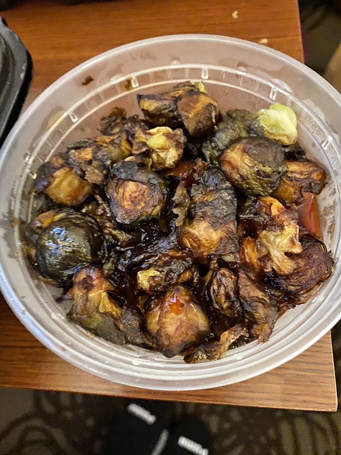 Brussels sprouts transformed from childhood nightmare to adult craving. These caramelized beauties have been kissed by smoke and sauce until completely irresistible.