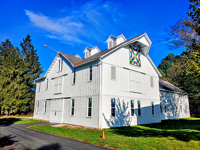 The white barn with its colorful quilt square represents rural Ohio's artistic soul. Proof that creativity thrives beyond city limits.