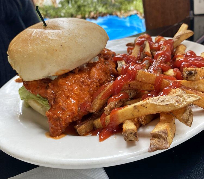 Buffalo chicken sandwich with fries: when comfort food decides to dress up for dinner.