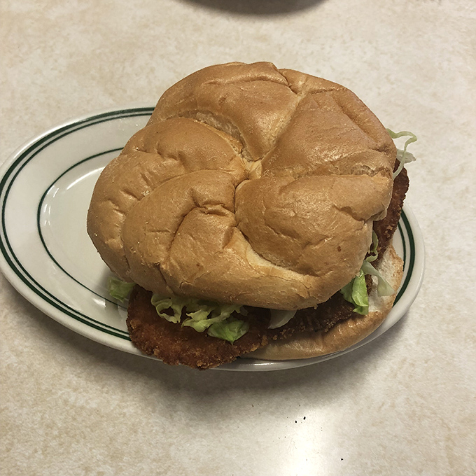 The burger that launched a thousand road trips. Simple, honest, and served on a bun that knows its supporting role perfectly.