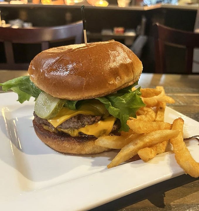 The burger that launched a thousand napkins &ndash; juicy, cheese-draped perfection on a glossy bun with fries that demand equal attention.
