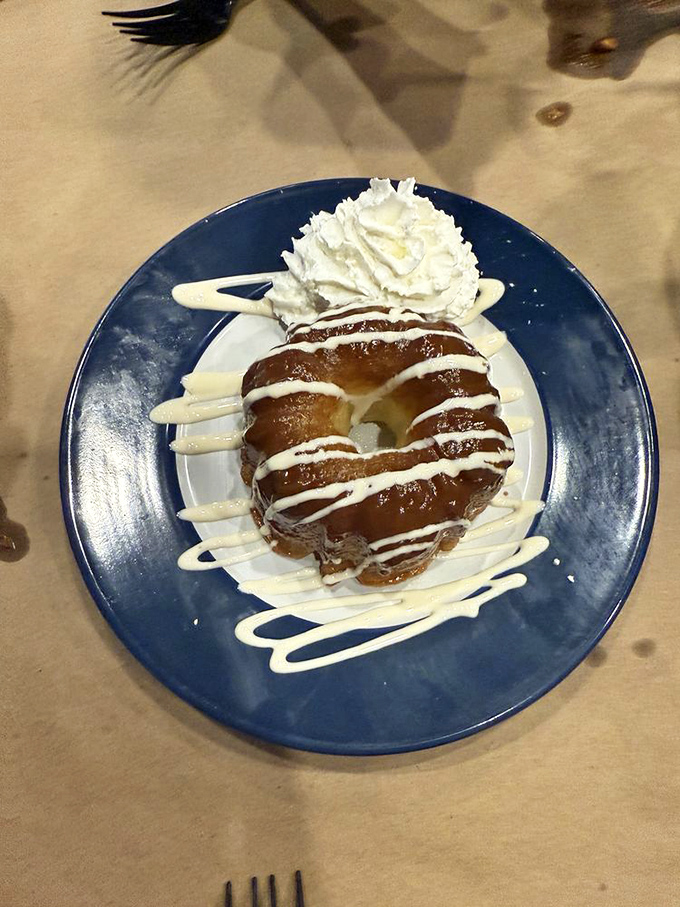 Dessert arrives as a chocolate masterpiece crowned with whipped cream, because every seafood feast deserves royal treatment.