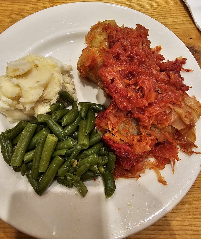 Cabbage rolls that would make any Eastern European grandmother nod in approval, nestled beside mashed potatoes that clearly never came from a box.
