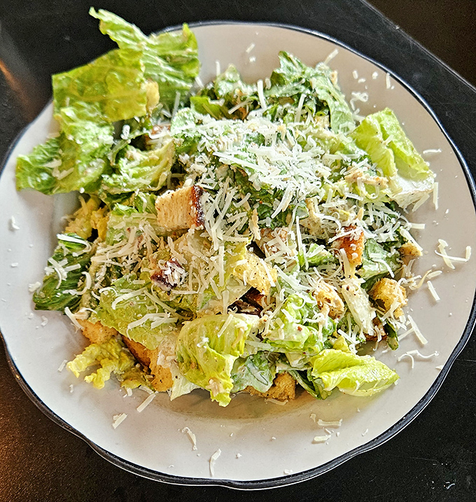 A Caesar salad that Julius himself would approve&mdash;crisp romaine, generous Parmesan, and croutons that actually deserve to be there.