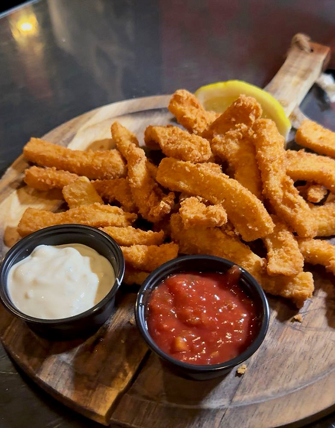 Calamari that's actually tender, not rubber bands in disguise. The dipping sauces are having their own little flavor party on the side.