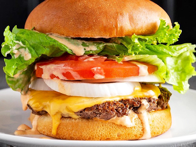 The California Burger stacks up like a edible skyscraper of West Coast dreams.