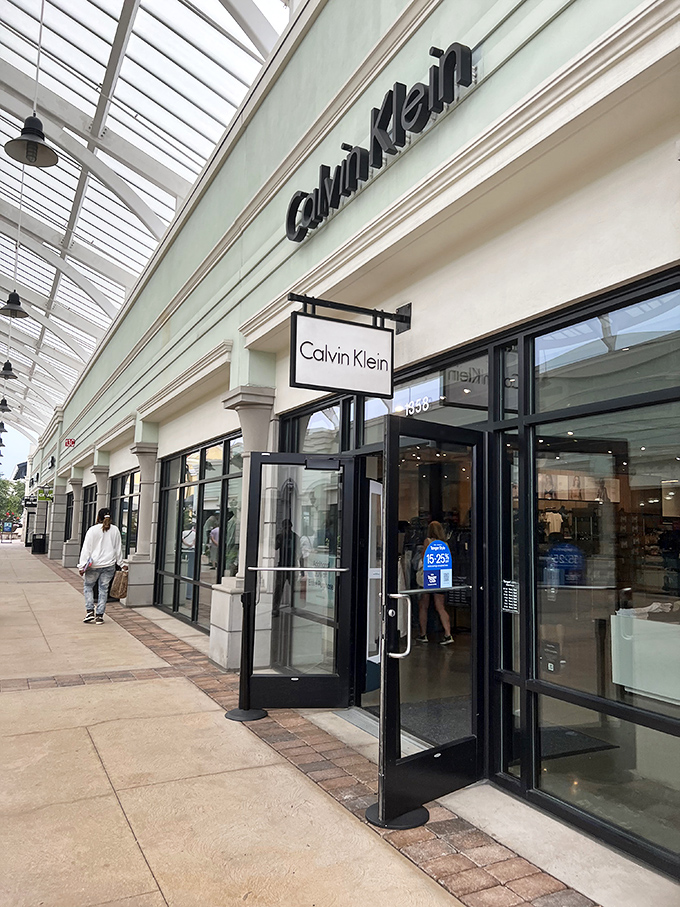 Calvin Klein: where minimalism meets maximum savings. That blue sign in the window is practically whispering "bargain" in a very sophisticated tone. 