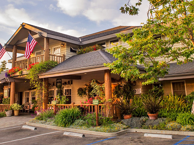 Cambria Pines Lodge welcomes visitors with rustic elegance and hanging flower baskets that could make a botanical garden jealous.