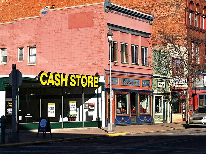 Downtown storefronts maintain their early 20th-century charm, even when advertising modern financial services. History with a practical purpose.