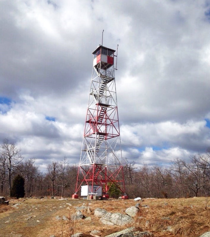 Catfish Firetower stands tall against the clouds, offering views that make your social media followers think you've suddenly become an adventure photographer.