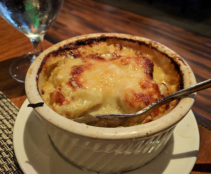 Cauliflower gratin proving vegetables can party too, dressed up in cream and cheese for the occasion.