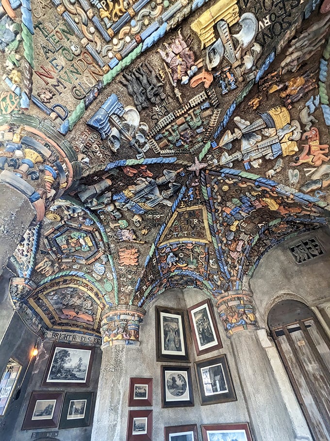 Look up! The ceiling resembles an archaeological dig turned inside out, with treasures embedded in concrete rather than buried beneath it. 