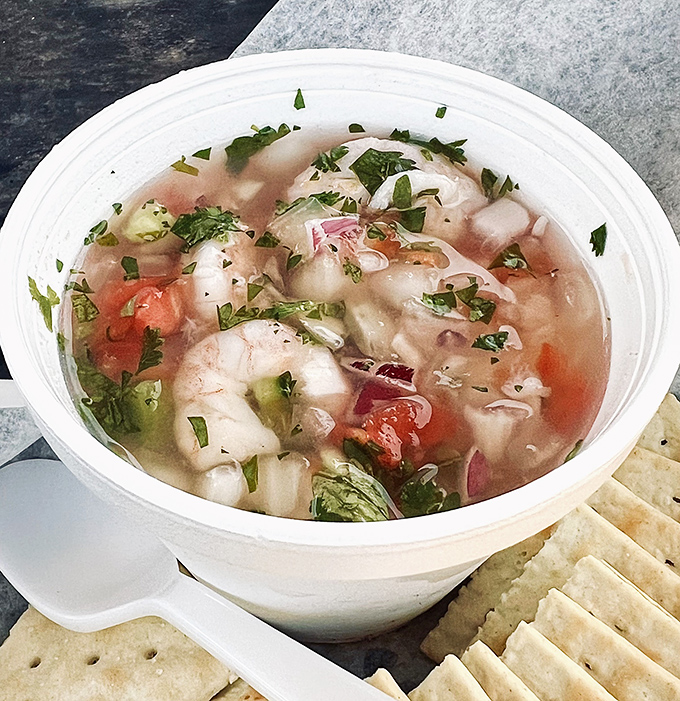 Ceviche so fresh it's practically still swimming. A cup of citrus-kissed seafood that tastes like summer vacation in every spoonful.