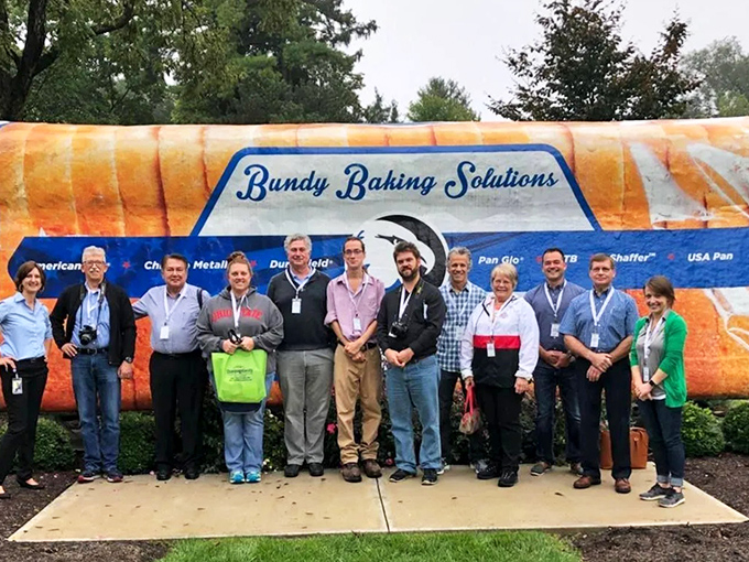 And I thought my grocery order was large! Visitors gather to appreciate the absurd scale of this beloved local landmark.