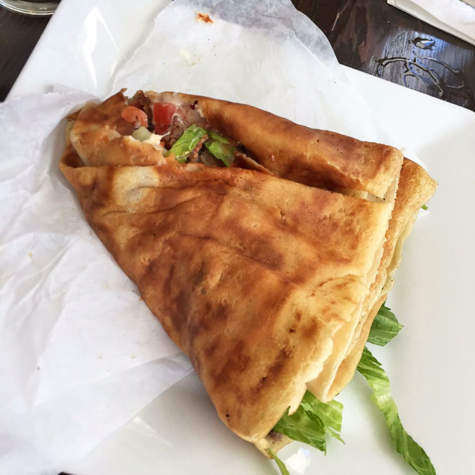 The humble cheeseburger gets the French treatment, proving that even American classics can don a beret and still feel right at home.