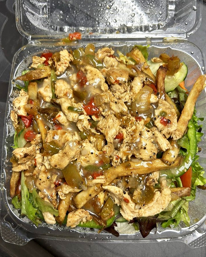 Protein with a purpose&mdash;tender chicken strips lounging on a bed of greens like they're at a spa retreat for delicious food.