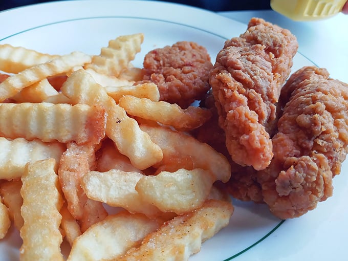 Chicken fingers and crinkle-cut fries &ndash; proof that sometimes the simplest pleasures are the most satisfying. Crispy, comforting, and absolutely no utensils required.