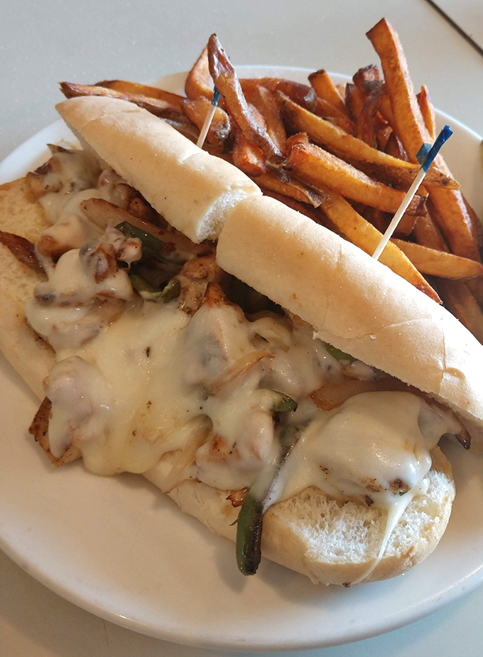 Melted cheese cascading over grilled chicken like a dairy waterfall. This sandwich doesn't just satisfy hunger&mdash;it performs culinary theater on your plate.