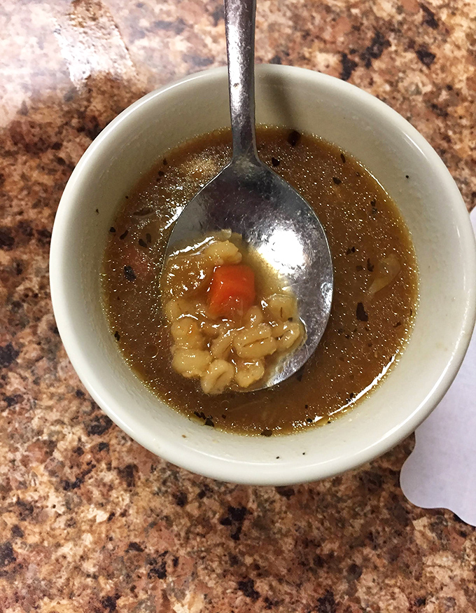 Homemade soup that looks like it simmered while dinosaurs roamed the earth&mdash;deep, rich broth that could cure anything from colds to existential crises.
