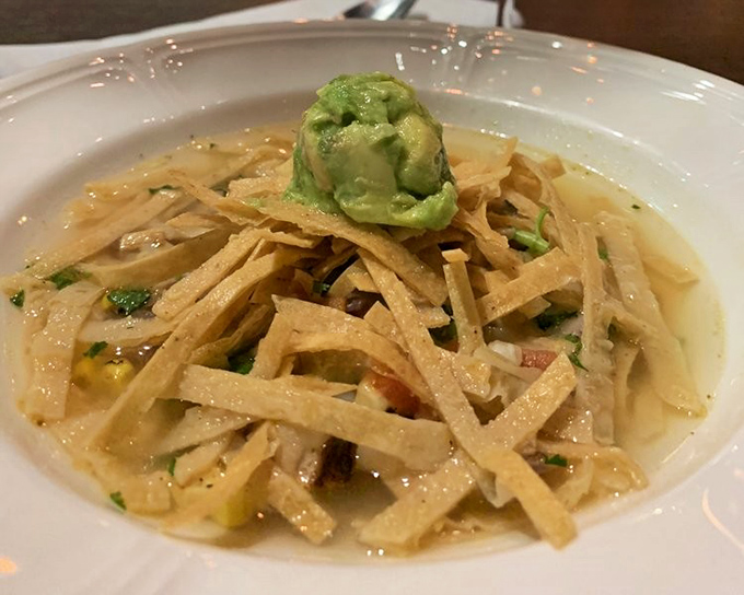 This isn't just soup &ndash; it's a Southwest vacation in a bowl, topped with crispy tortilla strips and a dollop of avocado bliss.