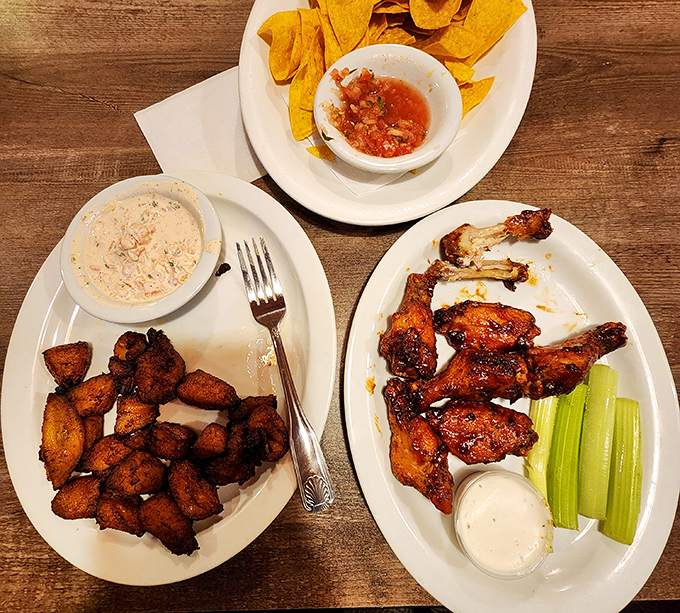 Crispy plantains, savory chicken wings, and homemade salsa &ndash; proof that sometimes the best meals are assembled from multiple small plates of joy.