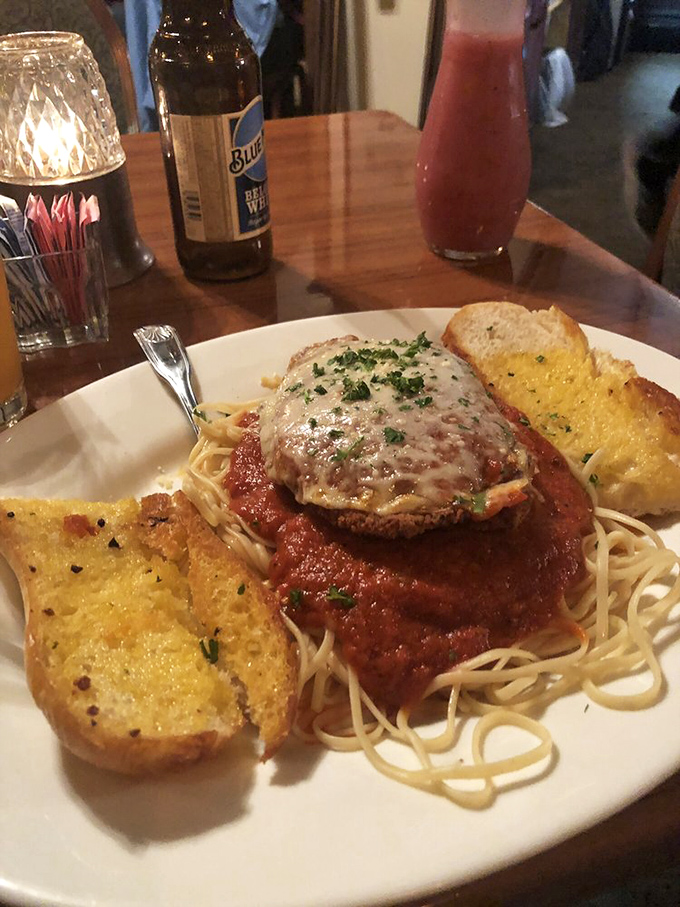 Chicken parmesan that could make an Italian grandmother nod in approval, with garlic bread that's worth every carb-counting minute on the treadmill tomorrow.