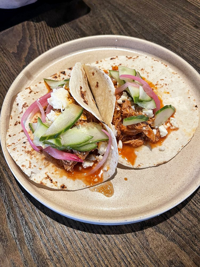 These aren't just tacos &ndash; they're carefully constructed flavor vessels where every cucumber slice and red onion has been placed with surgical precision.