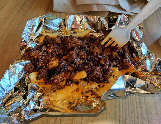 Chili cheese fries that blur the line between side dish and main event. The foil wrapper contains what can only be described as comfort in carbohydrate form.
