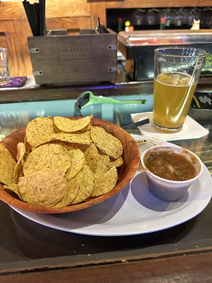 Simple pleasures done right&mdash;golden chips, house-made salsa, and a cold beer. Sometimes happiness really is that straightforward.
